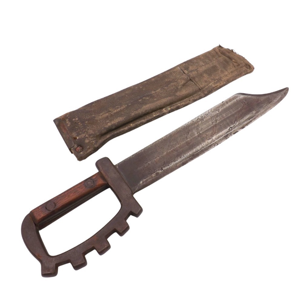 A WWII trench knife with knuckle duster hilt and bowie blade with ...