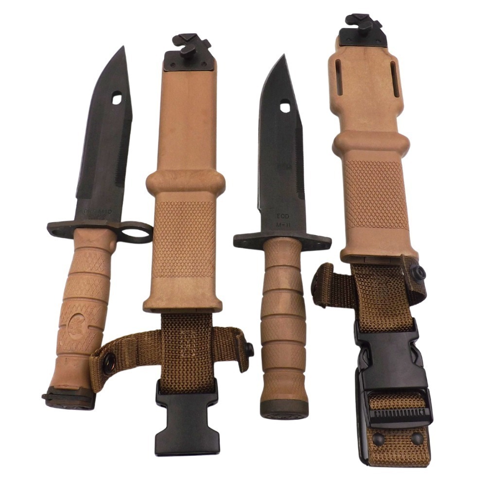 An OKC M10 bayonet with tan polymer scabbard, handle with USMC insignia ...