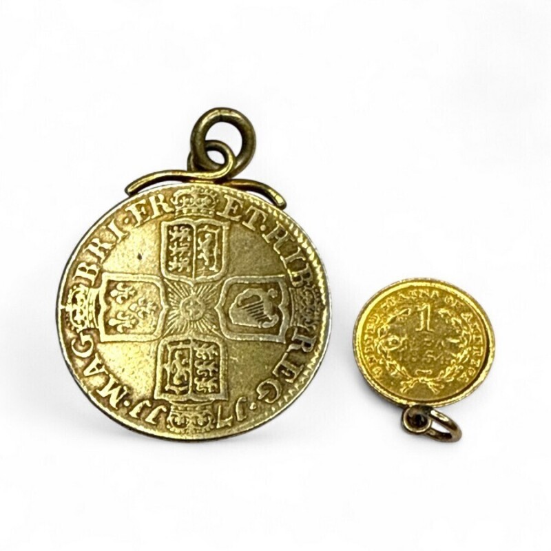 An 1854 Type 1 gold United States dollar, with soldered loop, together ...