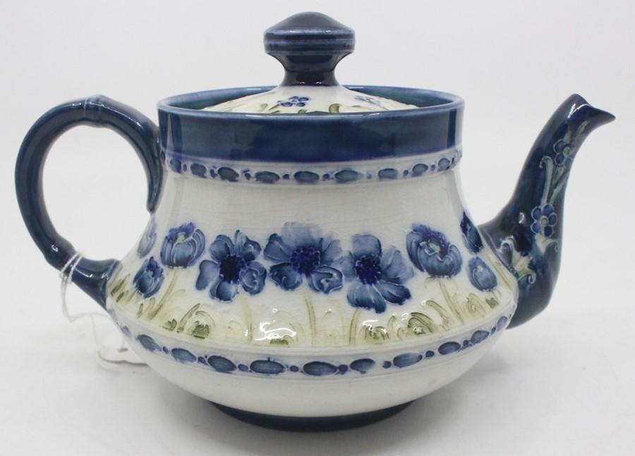 A William Moorcroft for MacIntyre teapot, poppy pattern, tubelined in ...