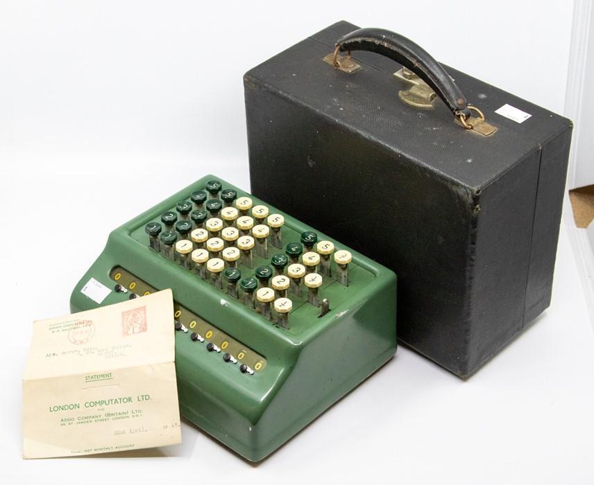 A cased Bell Punch Company adding machine, with original receipt, 1947 ...